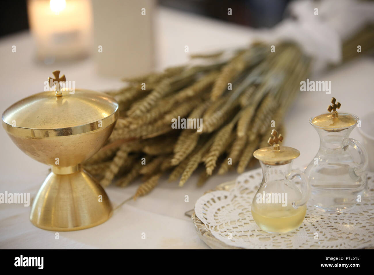 golden calyx and the ears of wheat over an altar in church with the ...