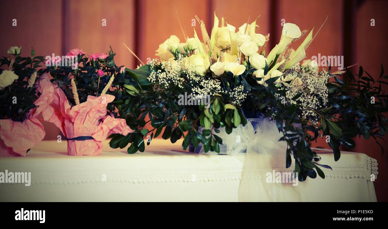 many pots of flowers on the altar in the catholic church with vintage ...