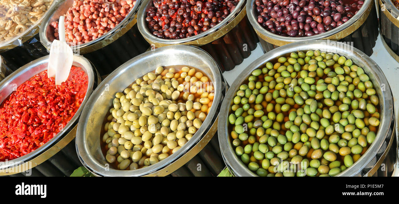 Mediterranean market stall with olives and red peppers Stock Photo - Alamy