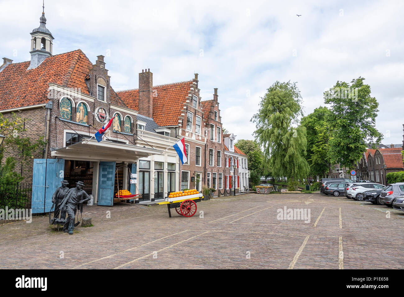 square with its traditional cheeses and houses and in the background a ...