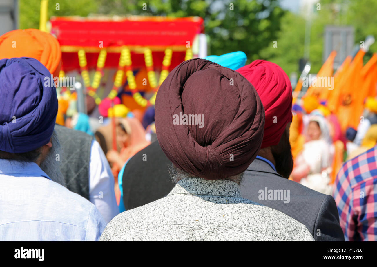 old sikh men with turbans on their head during a religious ceremony ...