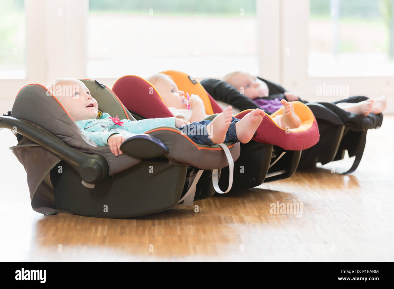 New-born babies in toddler group lying in baby shells Stock Photo - Alamy