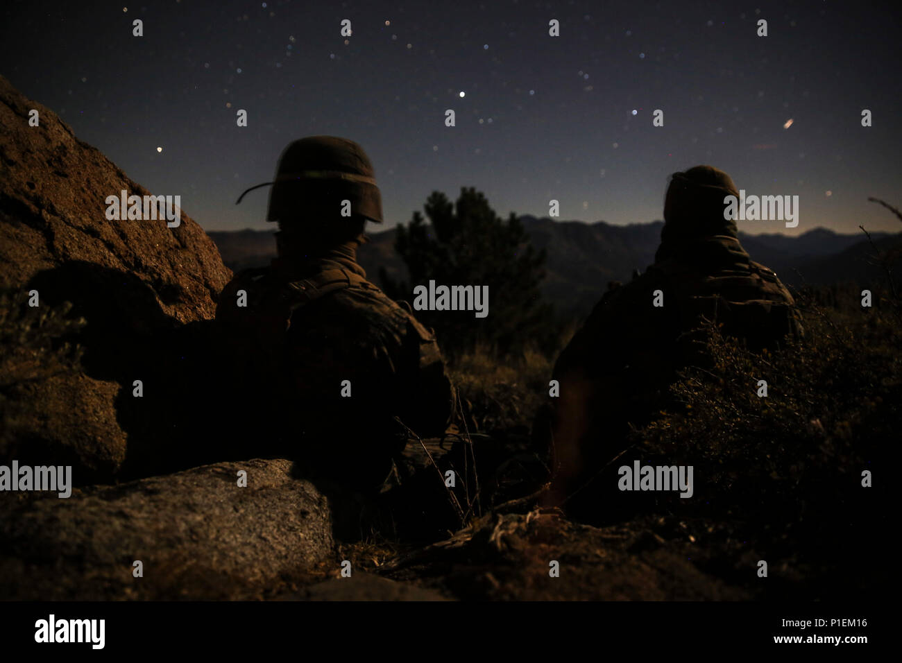 Marines with Company L, 3rd Battalion, 4th Marine Regiment, sit ...