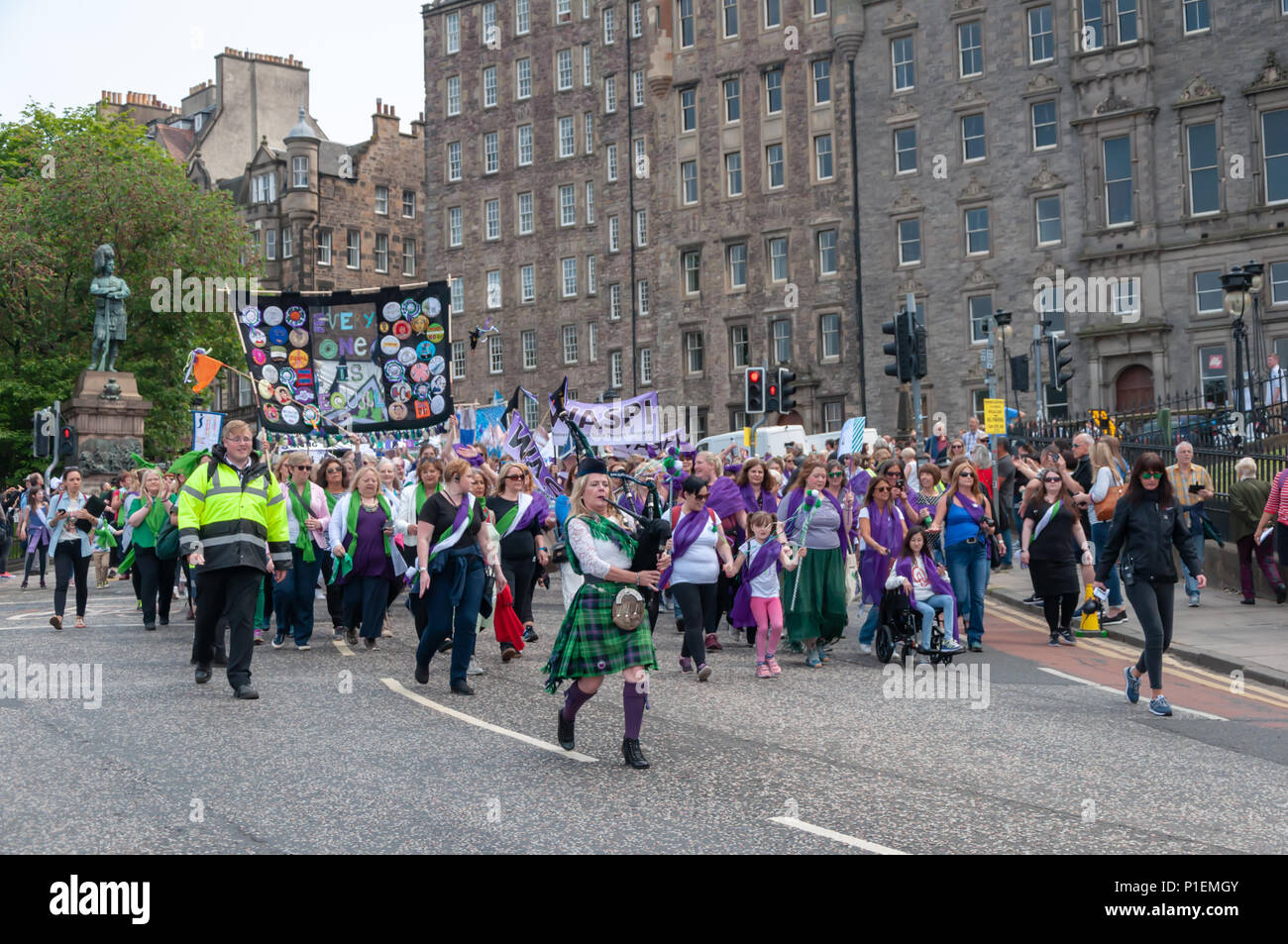 Piper Louise Marshall leads marchers during the Edinburgh Processions ...