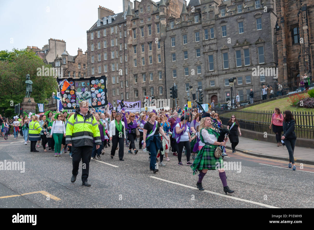 Piper Louise Marshall leads marchers during the Edinburgh Processions ...