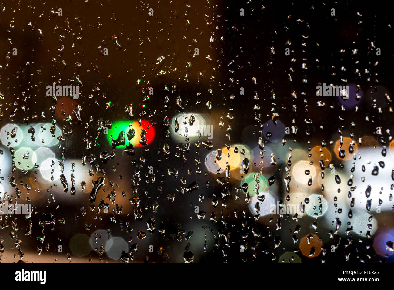 Bokeh city scene through rainy window hi-res stock photography and ...