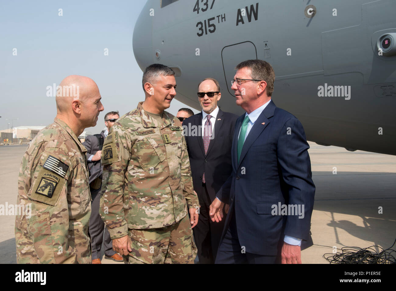 Secretary of Defense Ash Carter greets U.S. Army Lt. Gen. Stephen Townsend, commander of ...