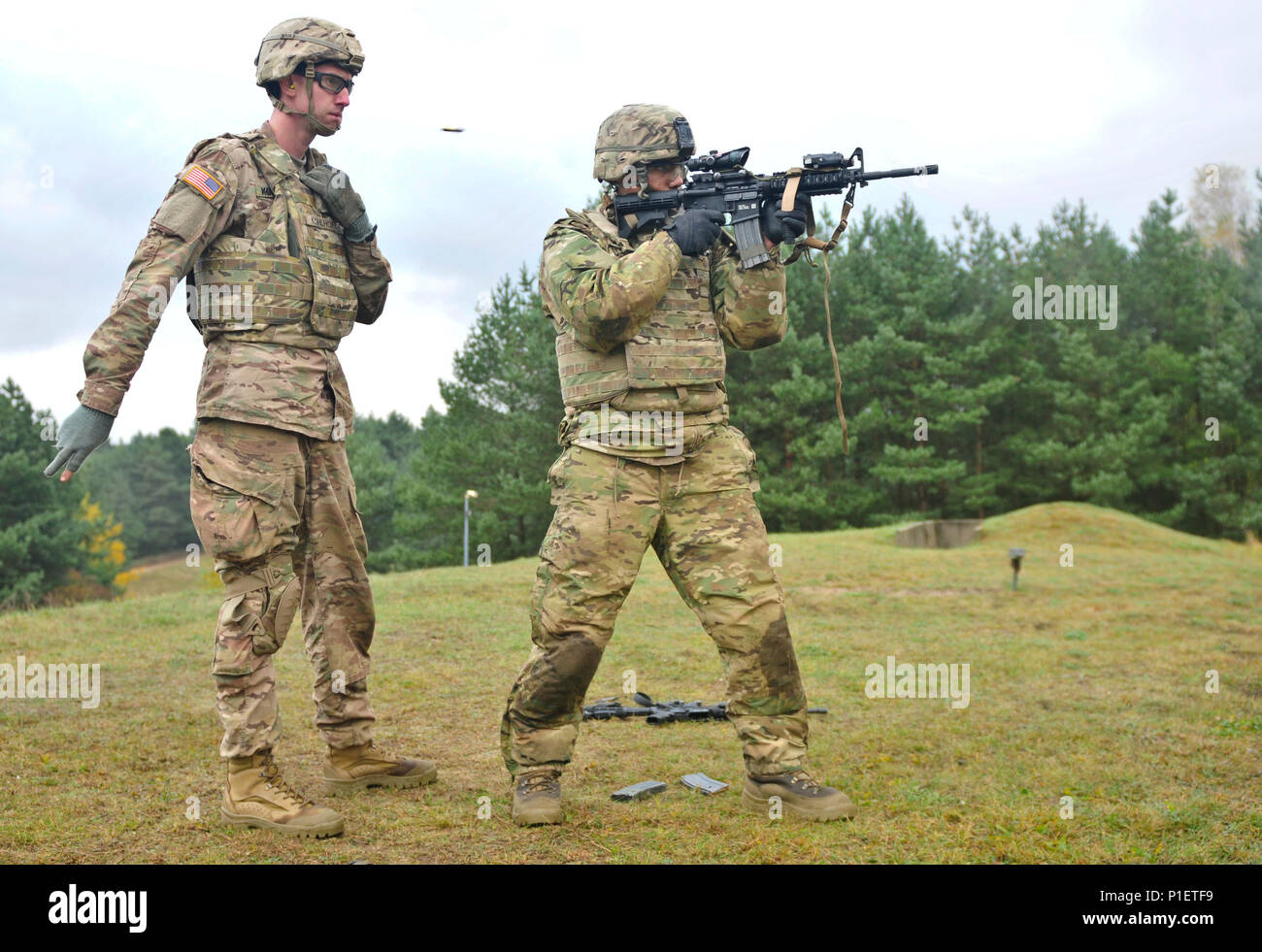 U.S. Army Spc. Dakota Kohlhof (left), cavalry scout, coaches Pfc. Joel ...