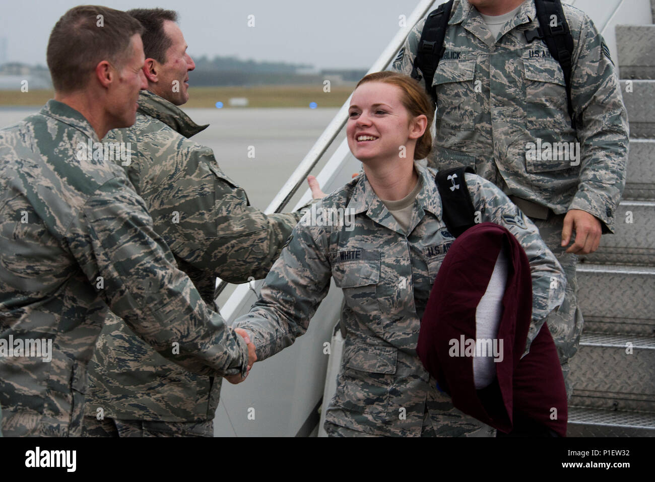 Col. Michael Thompson, 52nd Operations Group commander, left, greets an ...