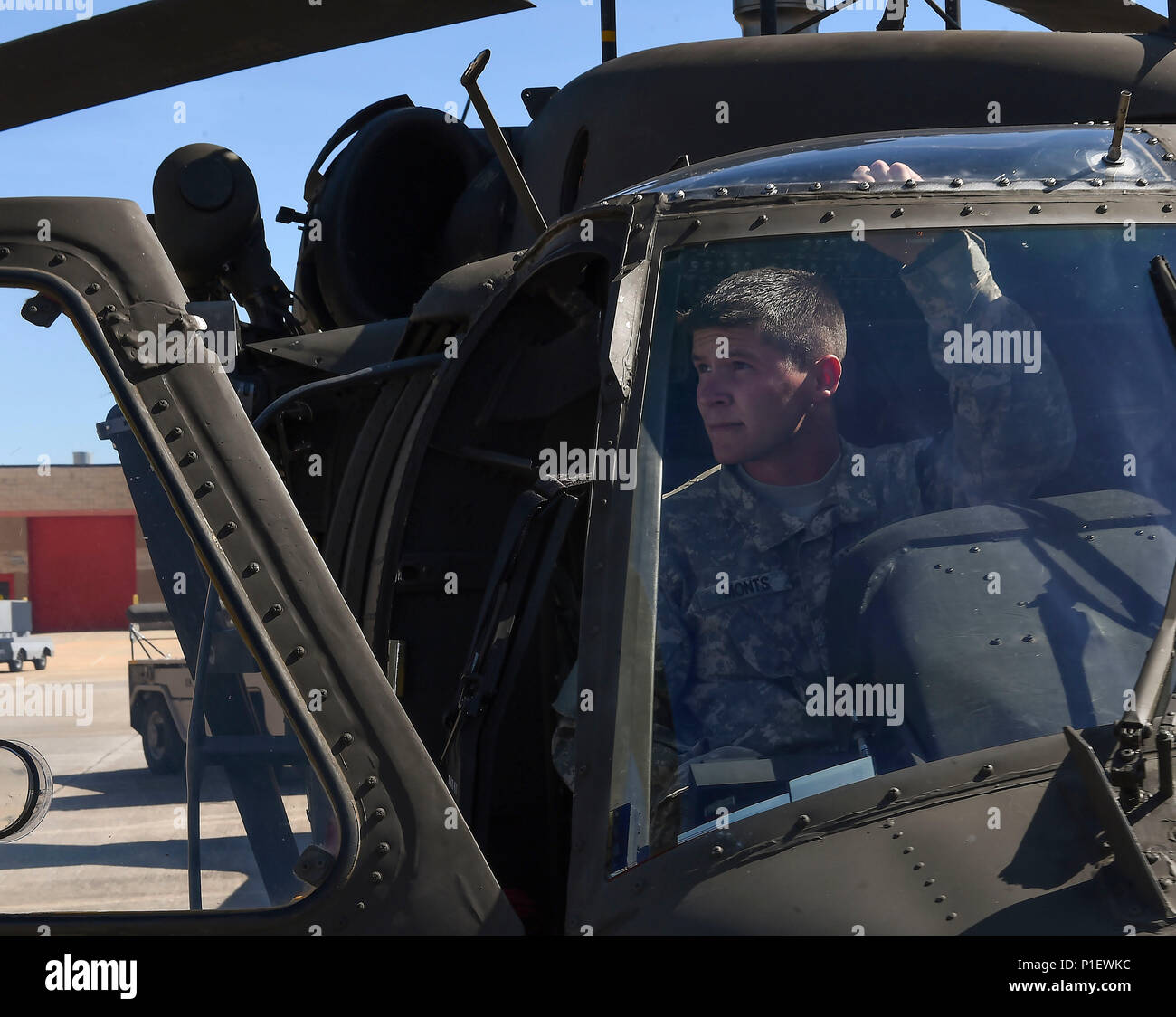 U.S. Army Spc. Tyler Monds, a UH-60 Black Hawk crew chief from the 1st ...