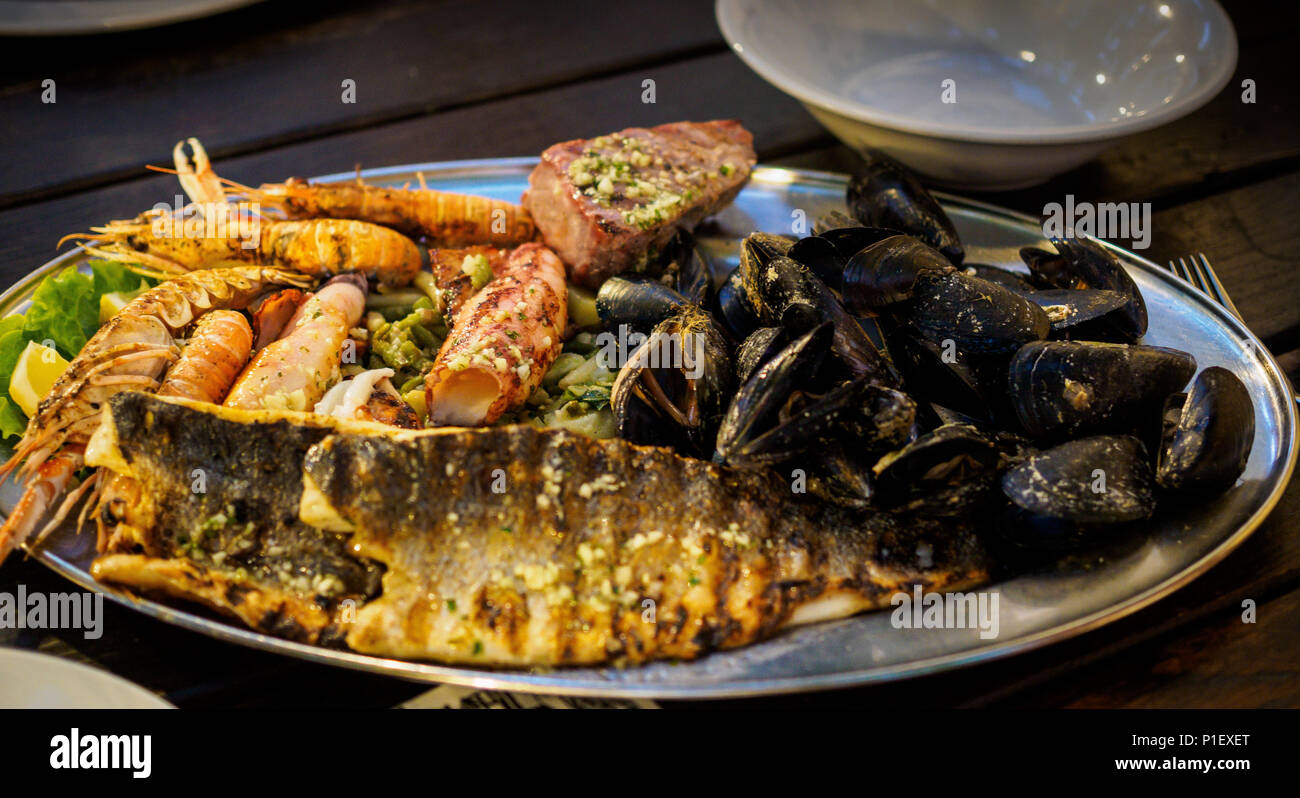 Plate of seafood prepared for dinner Stock Photo - Alamy
