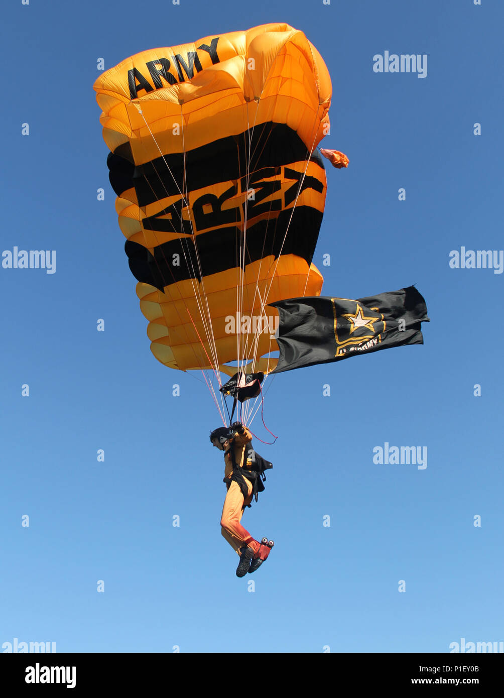 SPC Nicholas Grimm jumps in the Army Flag into the ceremony Stock Photo ...