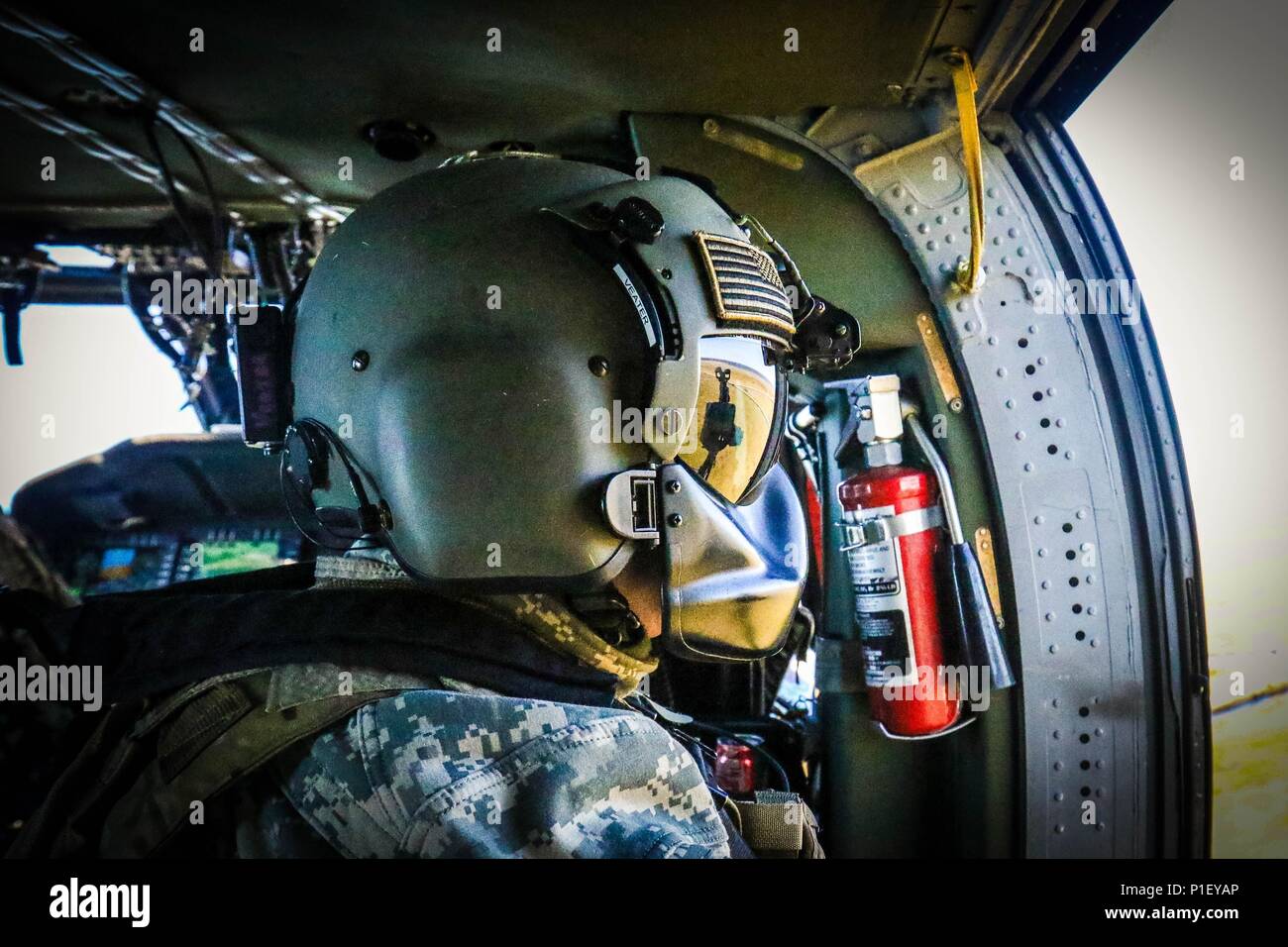 A UH-60 Black Hawk crew chief with 2nd Assault Helicopter Battalion ...