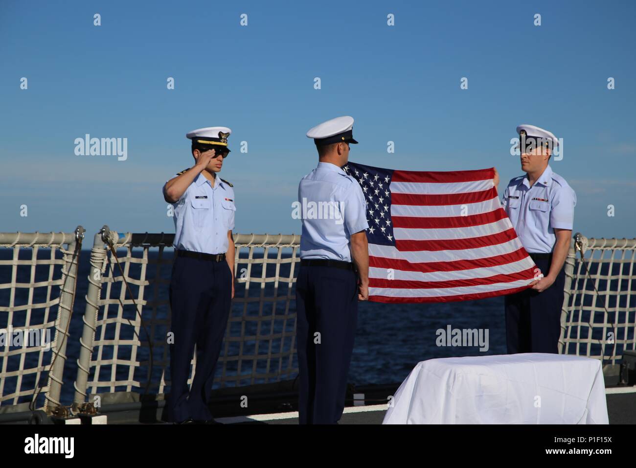 The crew of Coast Guard Cutter Campbell conduct a burial at sea on Oct ...