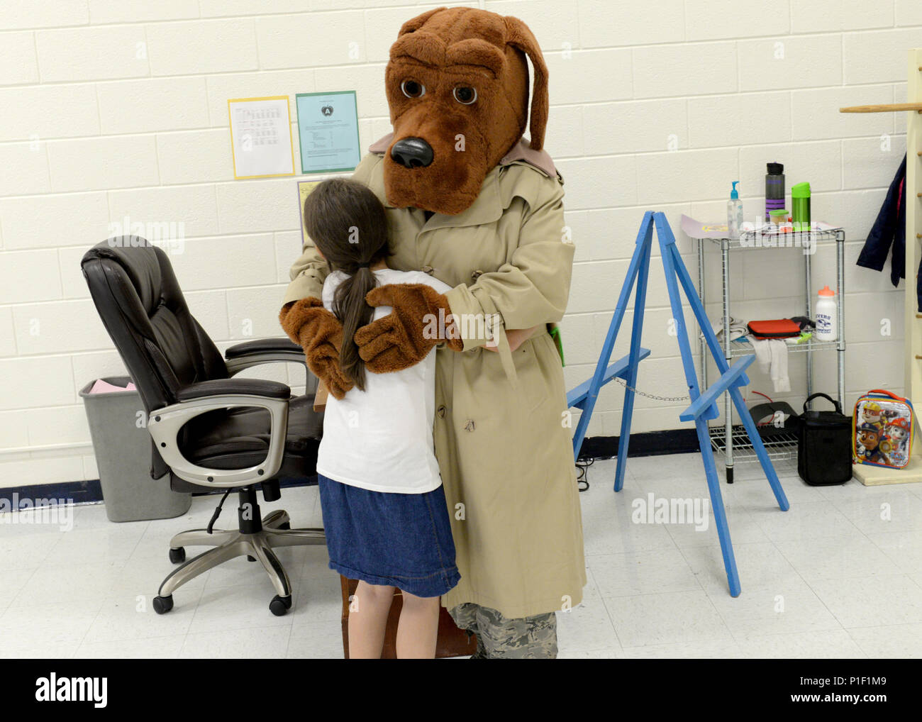 Scruff McGruff, the crime dog, gives hugs and high fives to children at ...