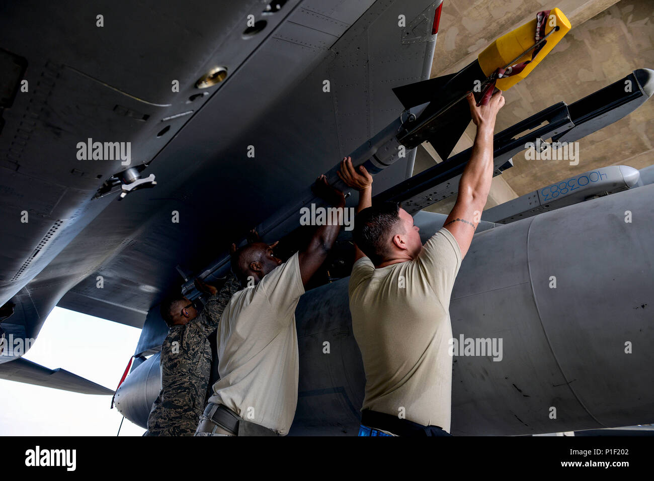 Weapons load crew team members from the 44th Aircraft Maintenance Unit ...