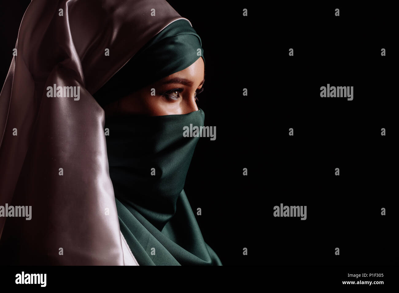 side view shot of eastern beautiful woman in satin hijab Stock Photo ...