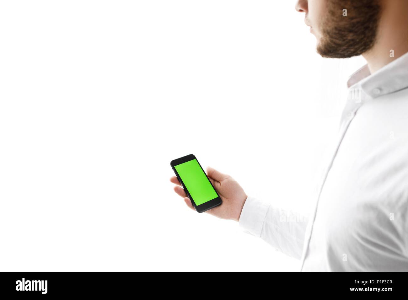 Man using mobile phone while standing near window. Chroma key Stock ...