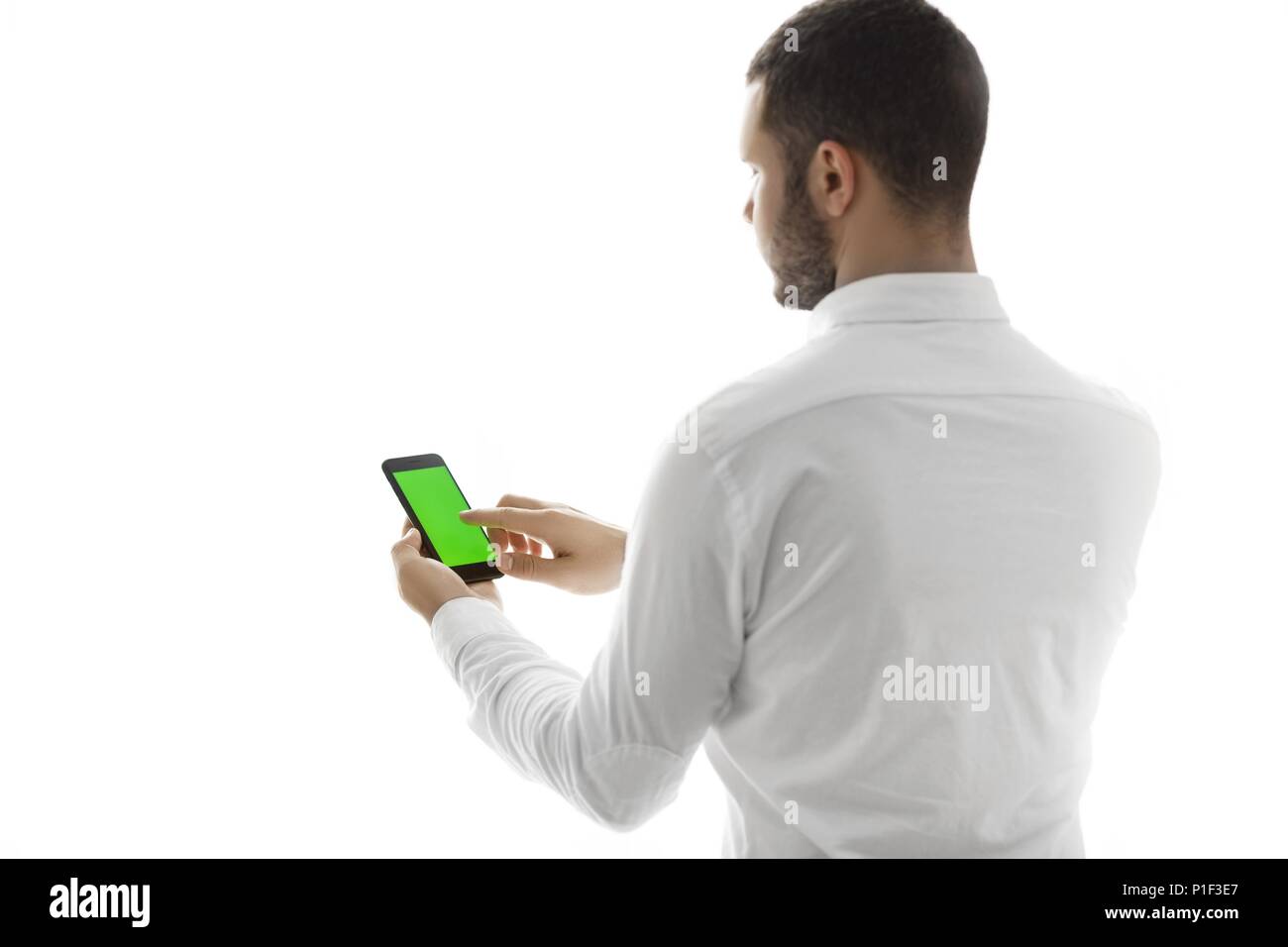 Man using mobile phone while standing near window. Chroma key Stock ...