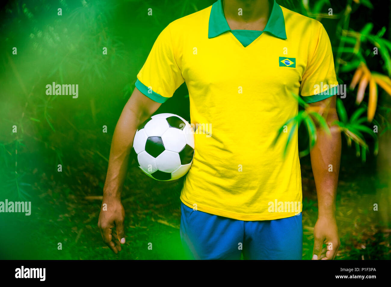Brazilian football player in Brazil flag and colors uniform standing in ...