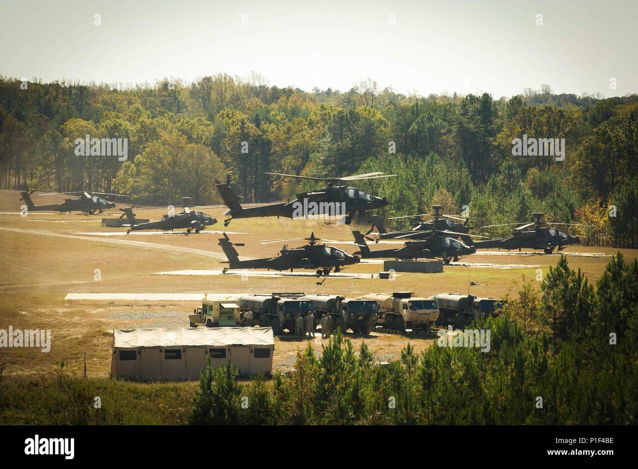 AH-64D apaches stage at the forward rearming and refueling point during ...
