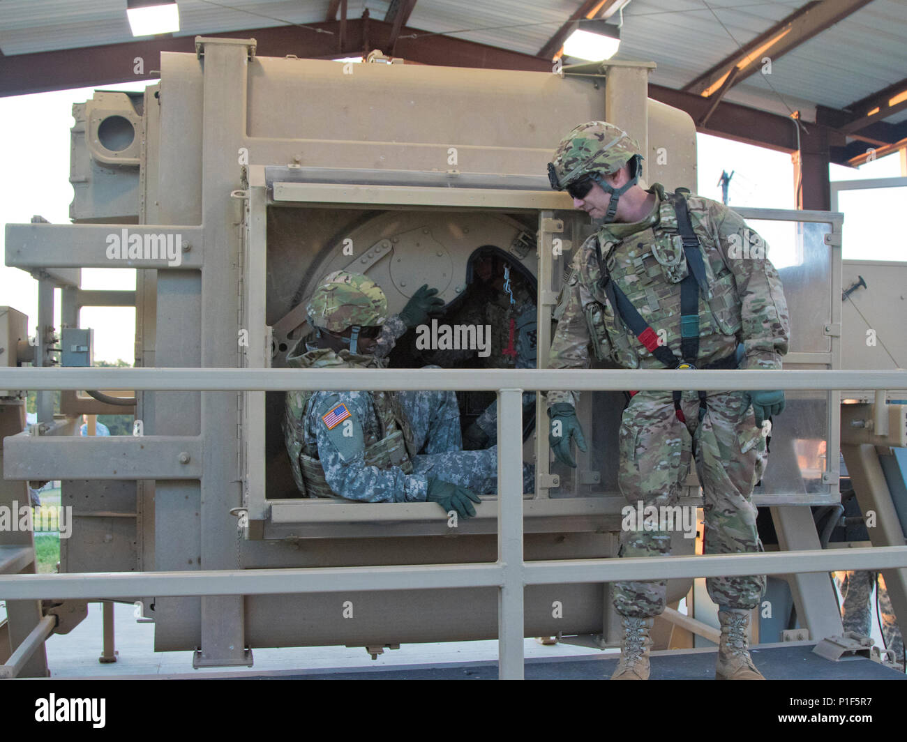 Soldiers of the 316th Sustainment Command (Expeditionary) egress from a ...