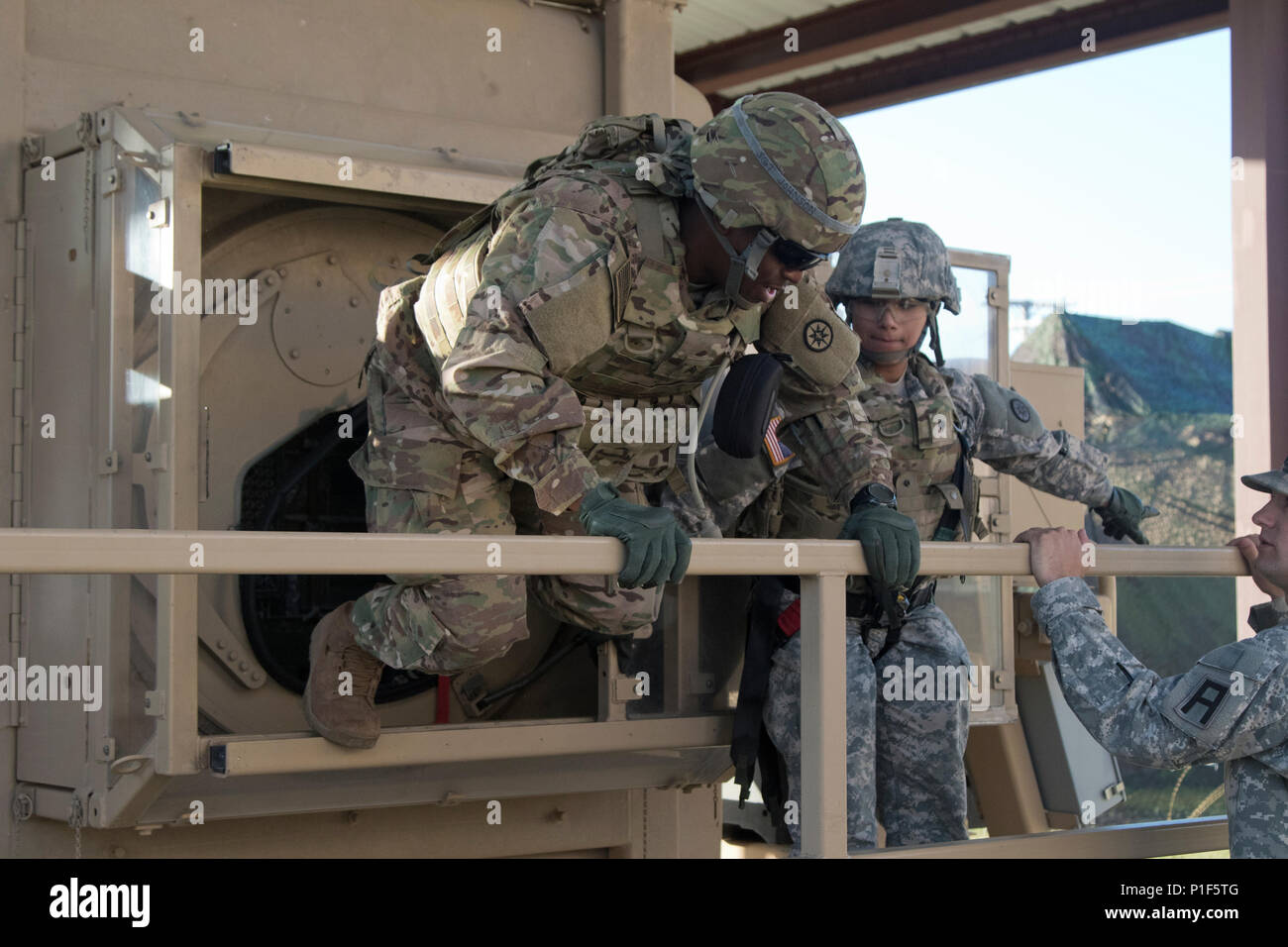 Soldiers of the 316th Sustainment Command (Expeditionary) egress from a ...