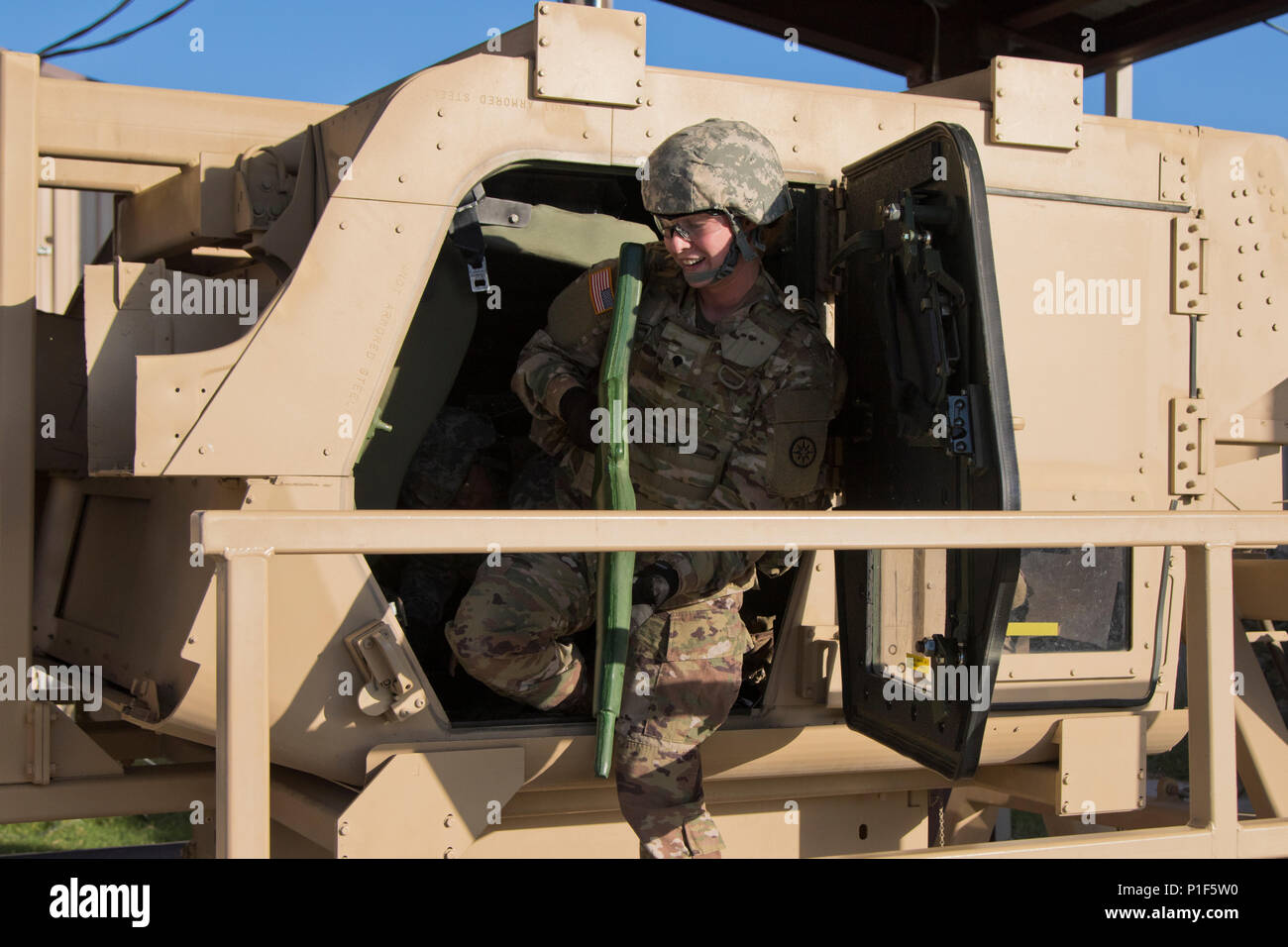 Soldiers of the 316th Sustainment Command (Expeditionary) egress from a ...