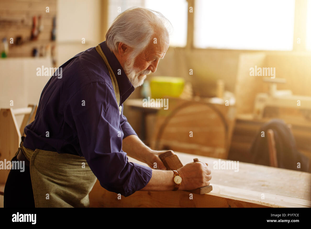 business first, pleasure afterwards. handy-man Stock Photo - Alamy