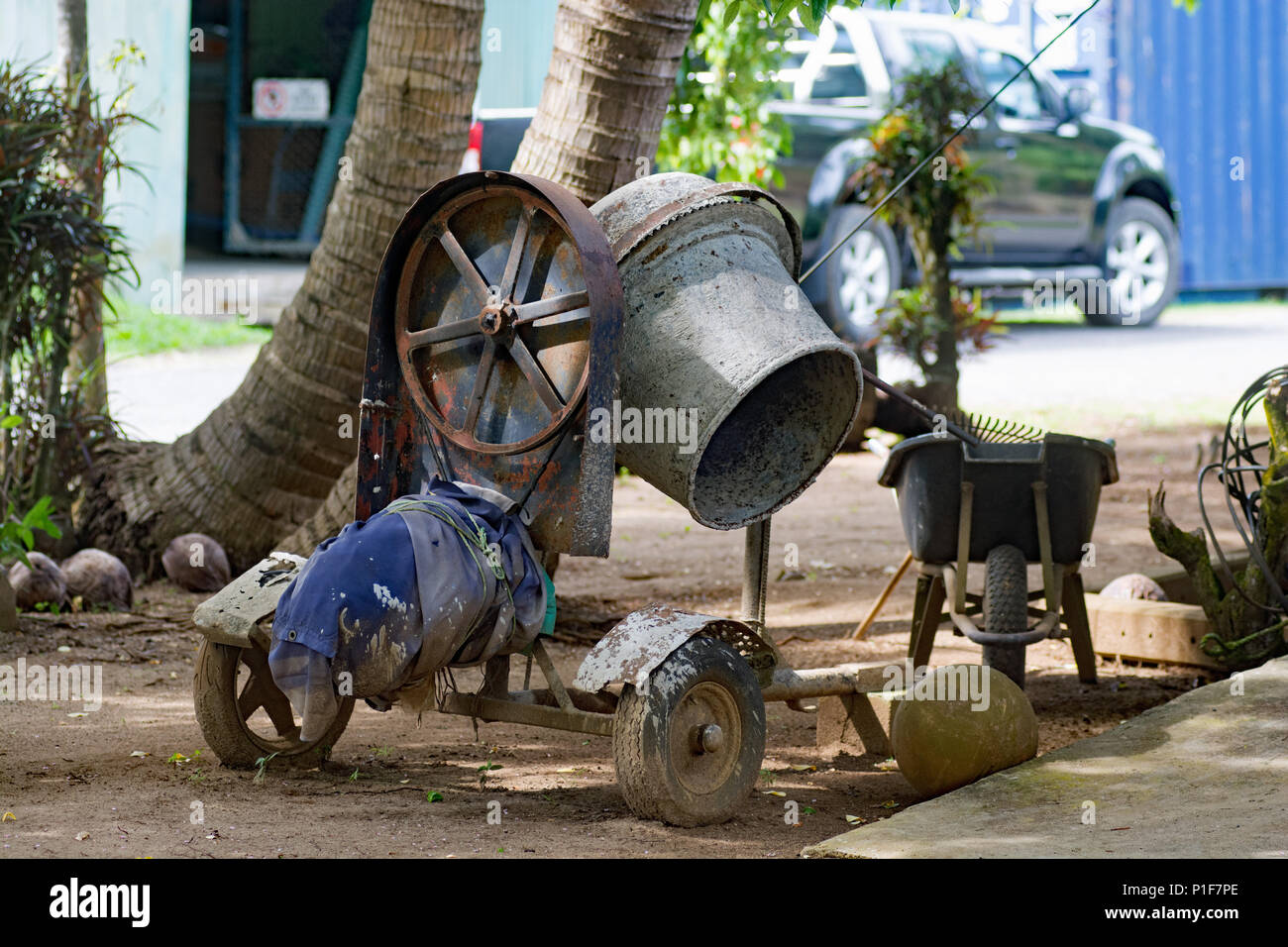 Concrete mixer & wheel barrow Stock Photo - Alamy
