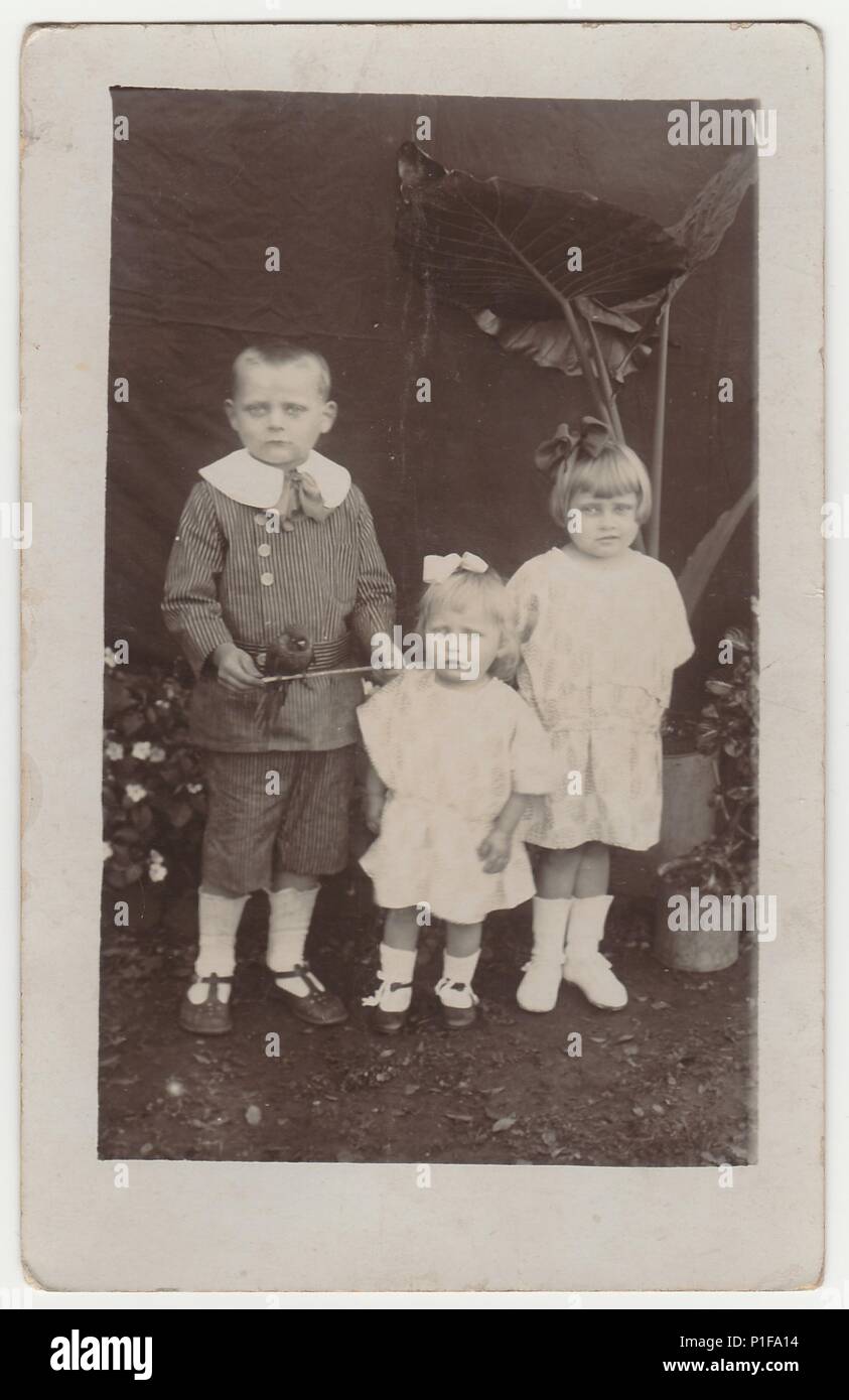 GERMANY - AUGUST, 1929: Vintage photo shows children (siblings) pose ...