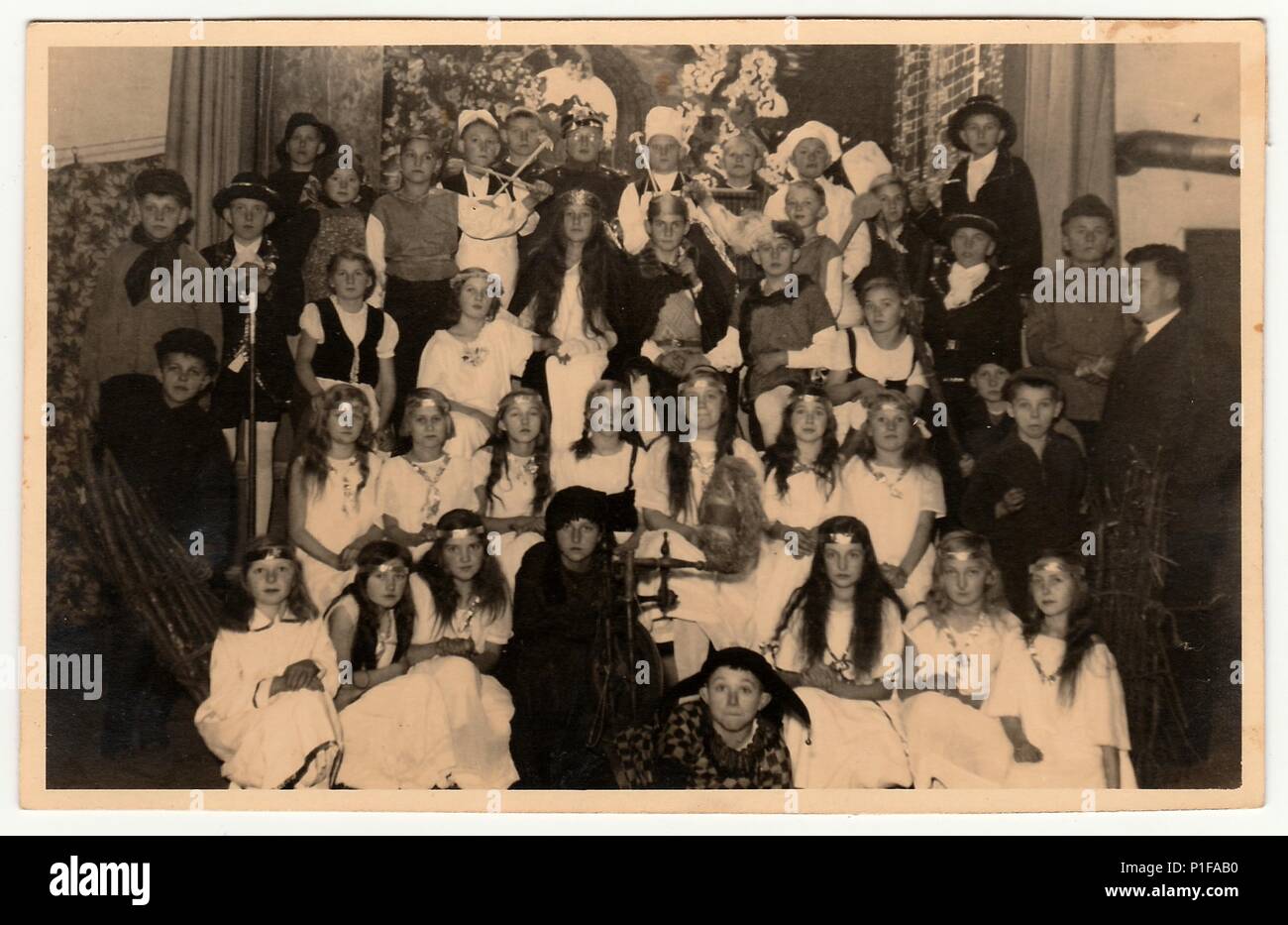 EILENBURG, GERMANY - CIRCA 1950s: Vintage photo shows pupils to pose ...