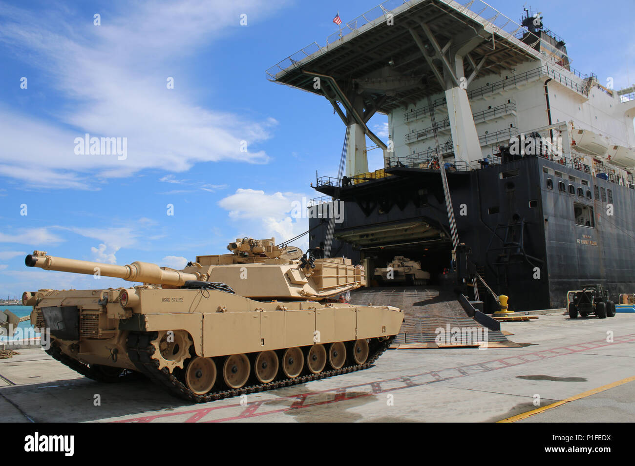 SANTA RITA, Guam (Oct. 28, 2016) -- A Marine Corps tank sits adjacent ...