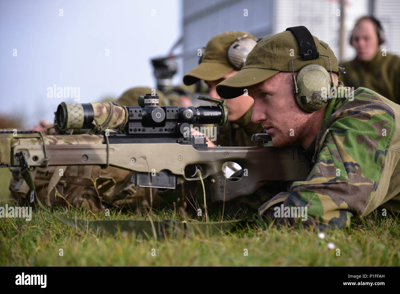 A Dutch soldier makes a sight adjustment before firing during the Day ...