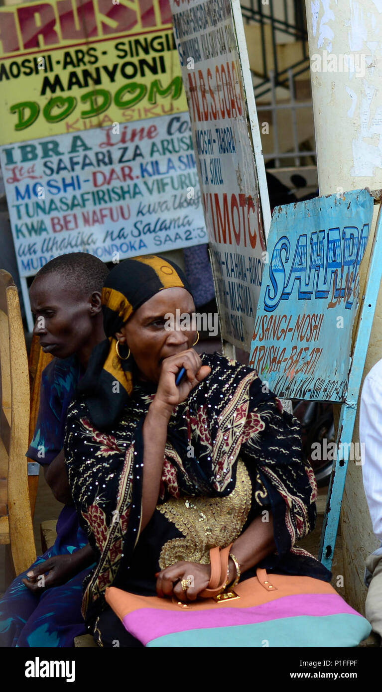 A Tanzanian woman waiting for the bush taxi in Moshi, Tanzania Stock ...