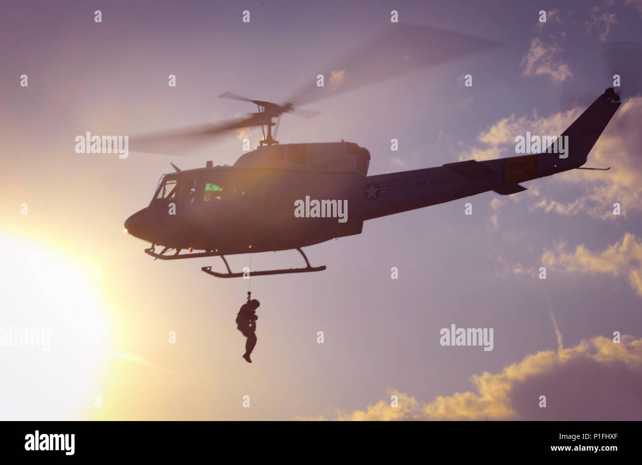 Members of the 459th Airlift Squadron hoist a Survival, Evasion ...
