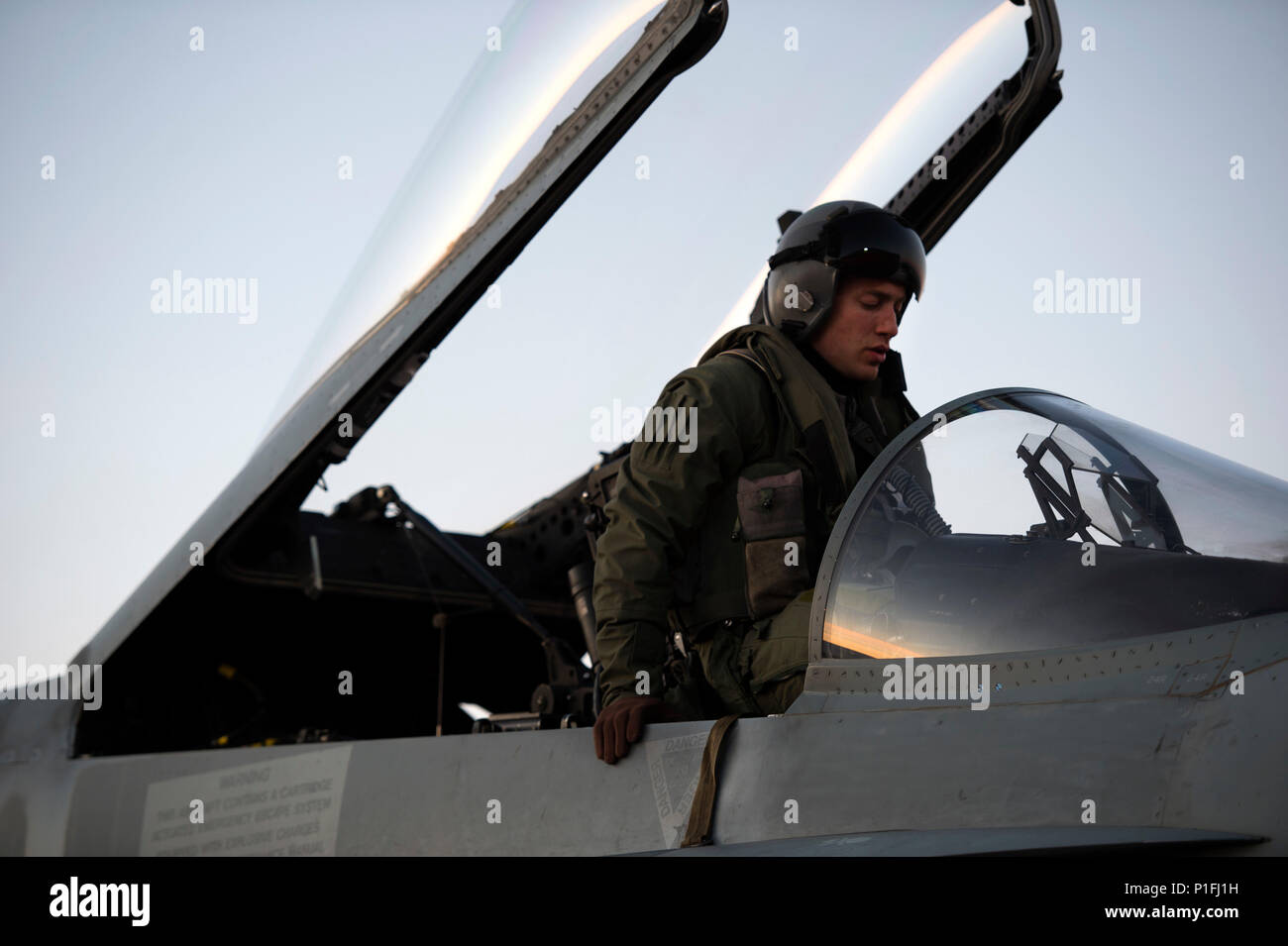 Canadian Air Force Matt Stokes, 425th Squadron pilot enters the cockpit ...