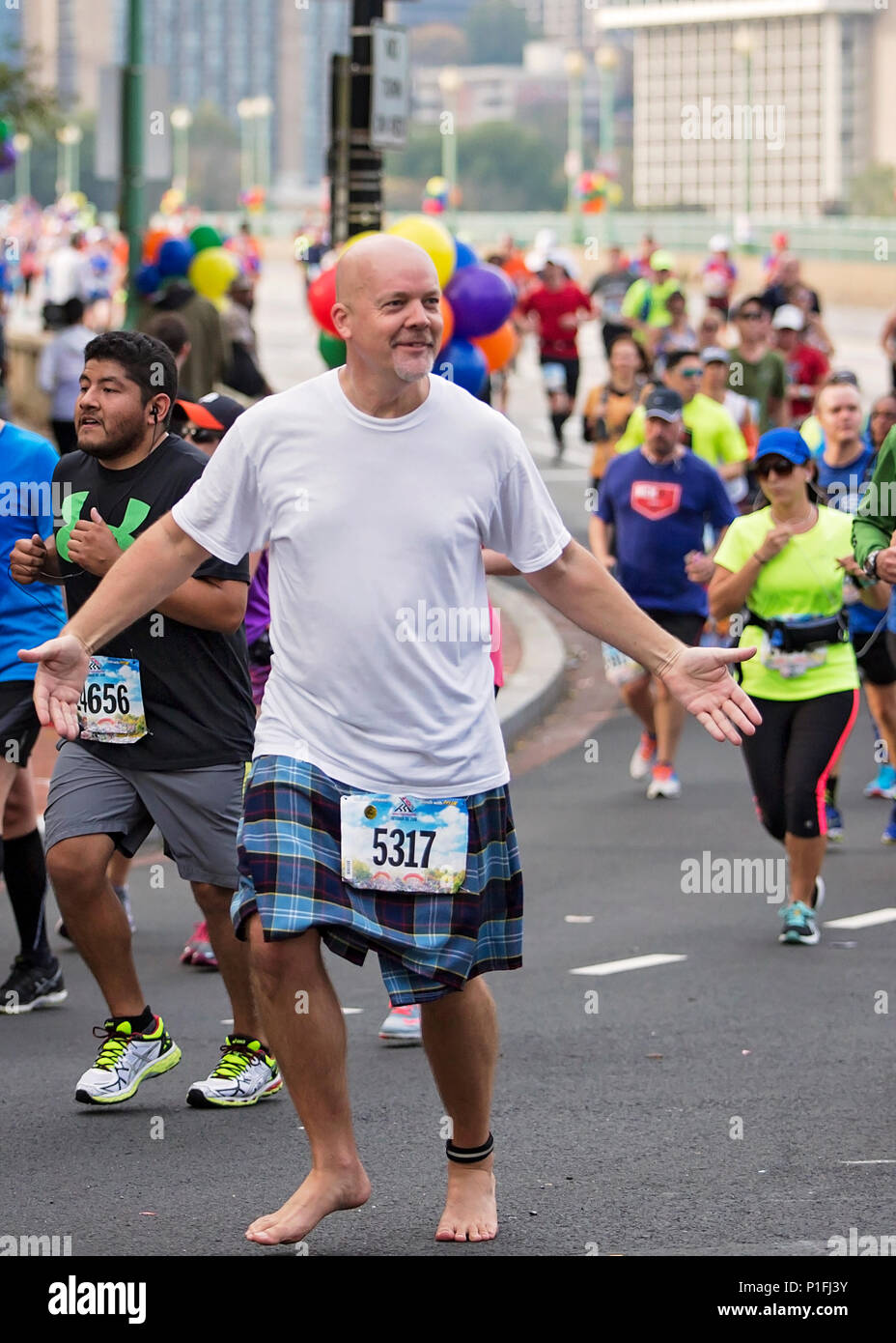 Participant Todd Wheeler runs in a kilt and bare foot during the 41st ...