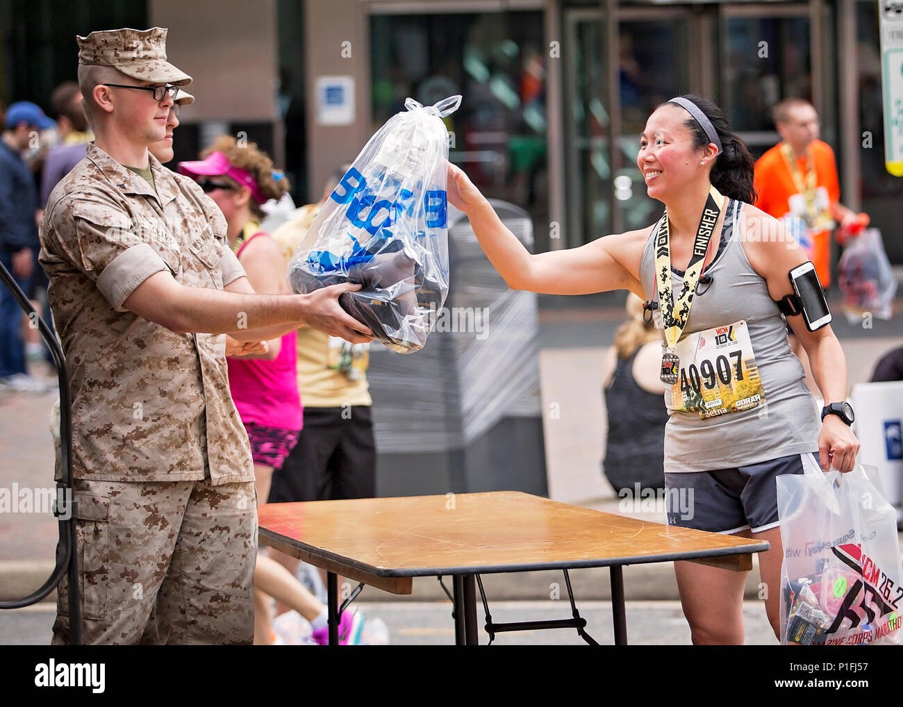 Runner Sharon Brinkerhoff picks up her belongings at the UPS Baggage ...