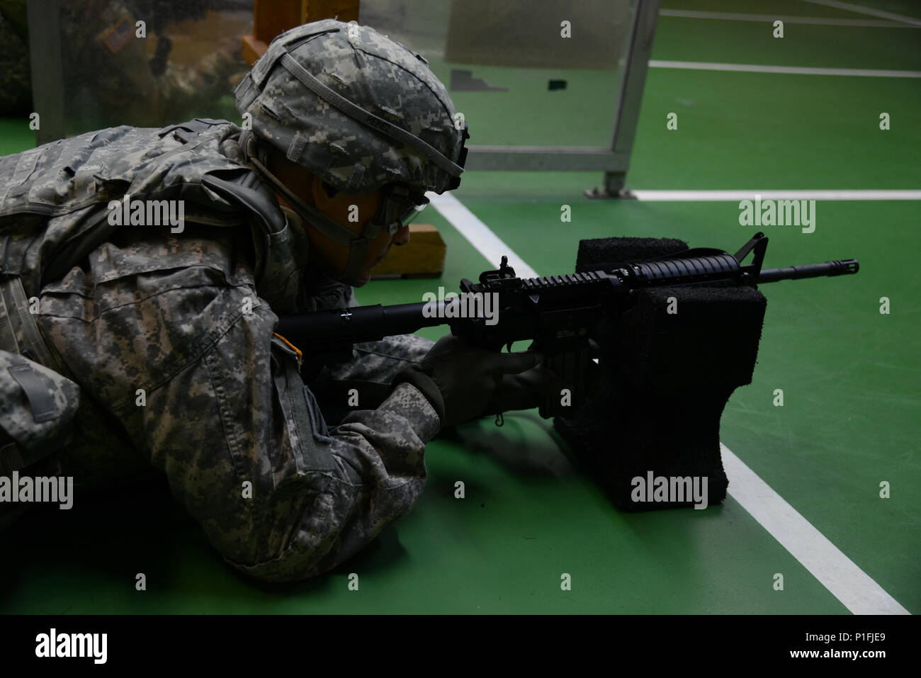 U.S. Army Spc. Gabriel Perez, assigned to 39th Signal Battalion, loads ...