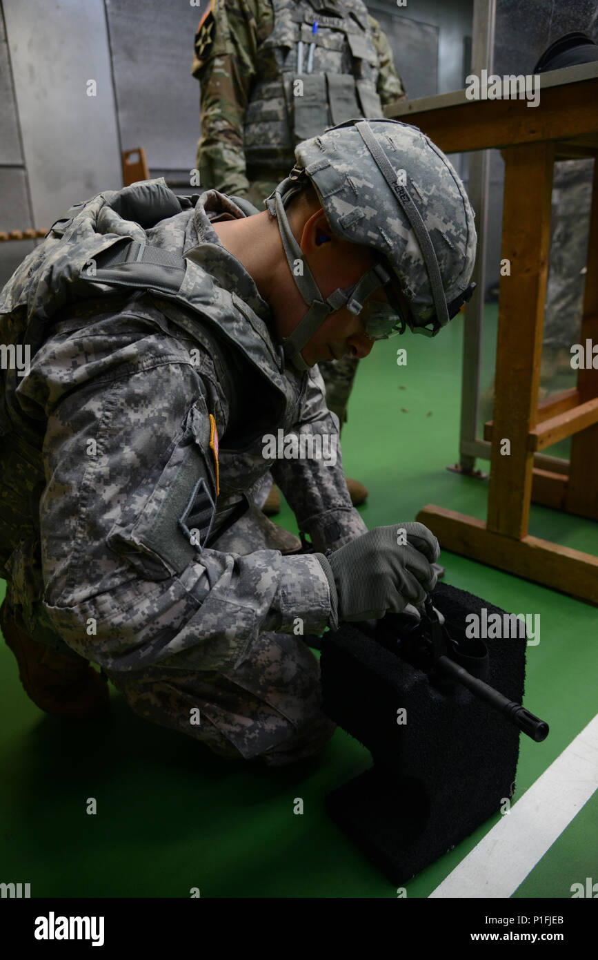 U.S. Army Spc. Gabriel Perez, assigned to 39th Signal Battalion, zeroes ...