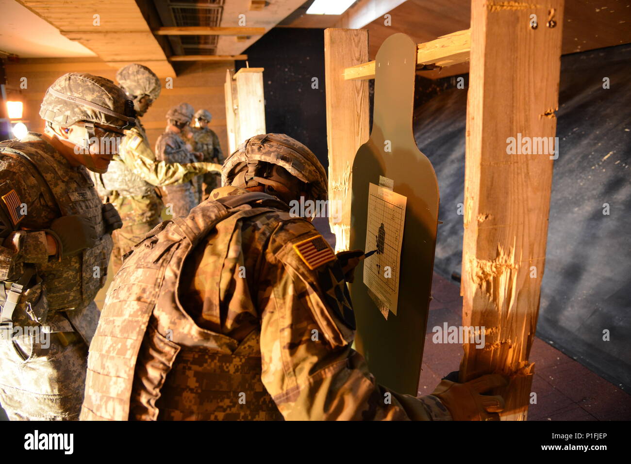 U.S. Army Sgt. Alexi Hernandez, range safety Officer, circles the ...