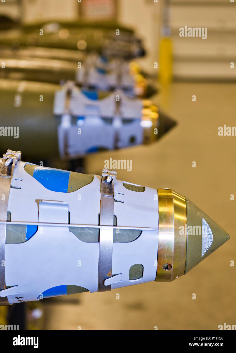 Four assembled GBU-38s line a bomb rack at Minot Air Force Base, N.D ...