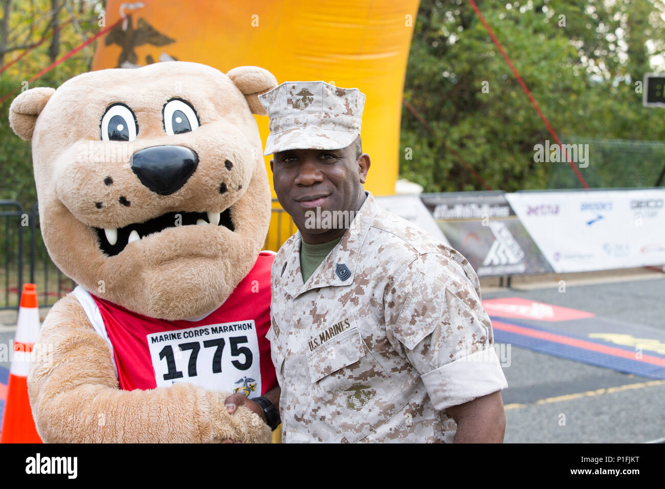 Miles, one of the the Marine Corps Marathon (MCM) mascots, poses for a ...