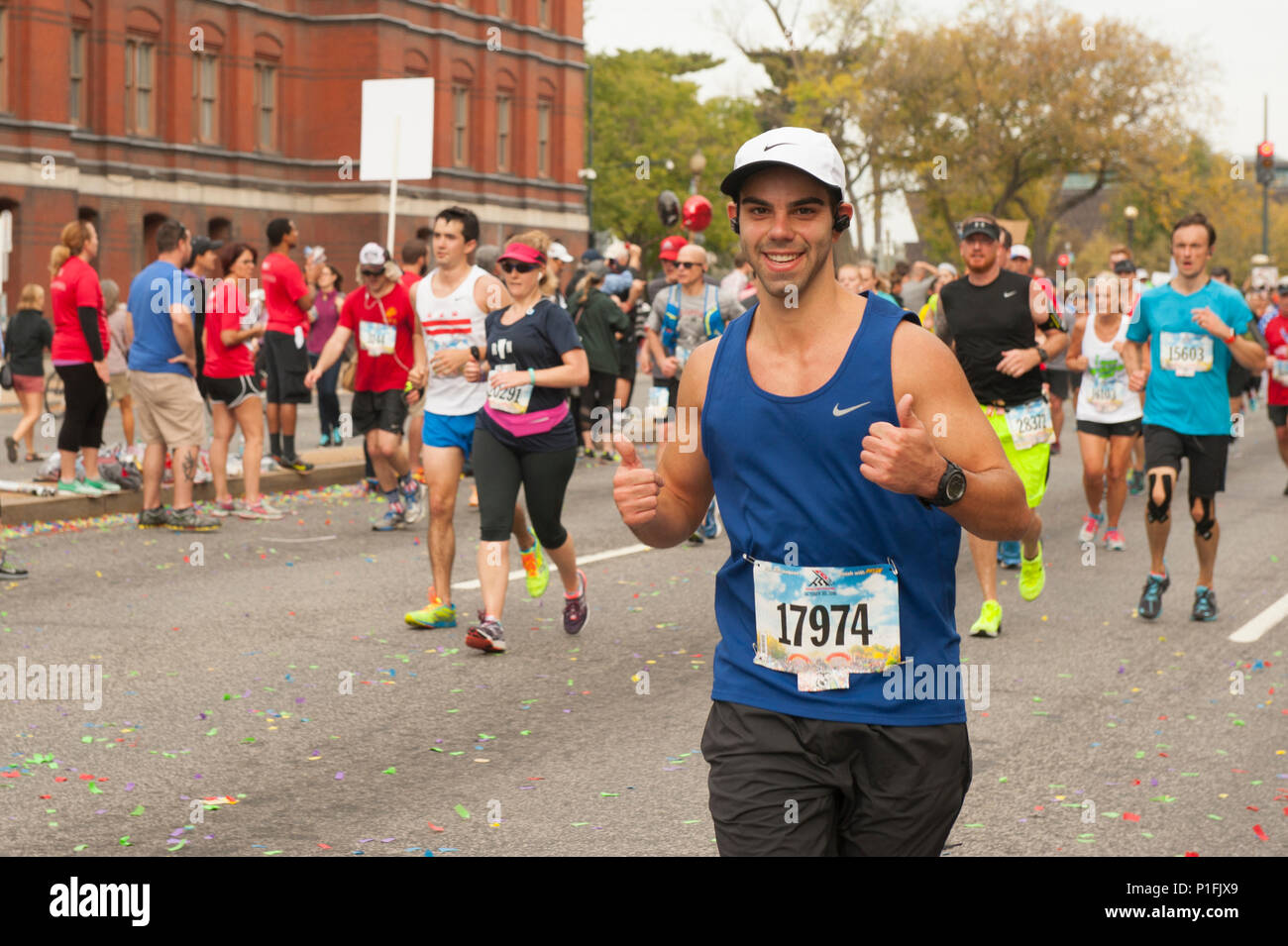 Daniel Borst, Yorba Linda, Calif., gives two thumbs up while running ...