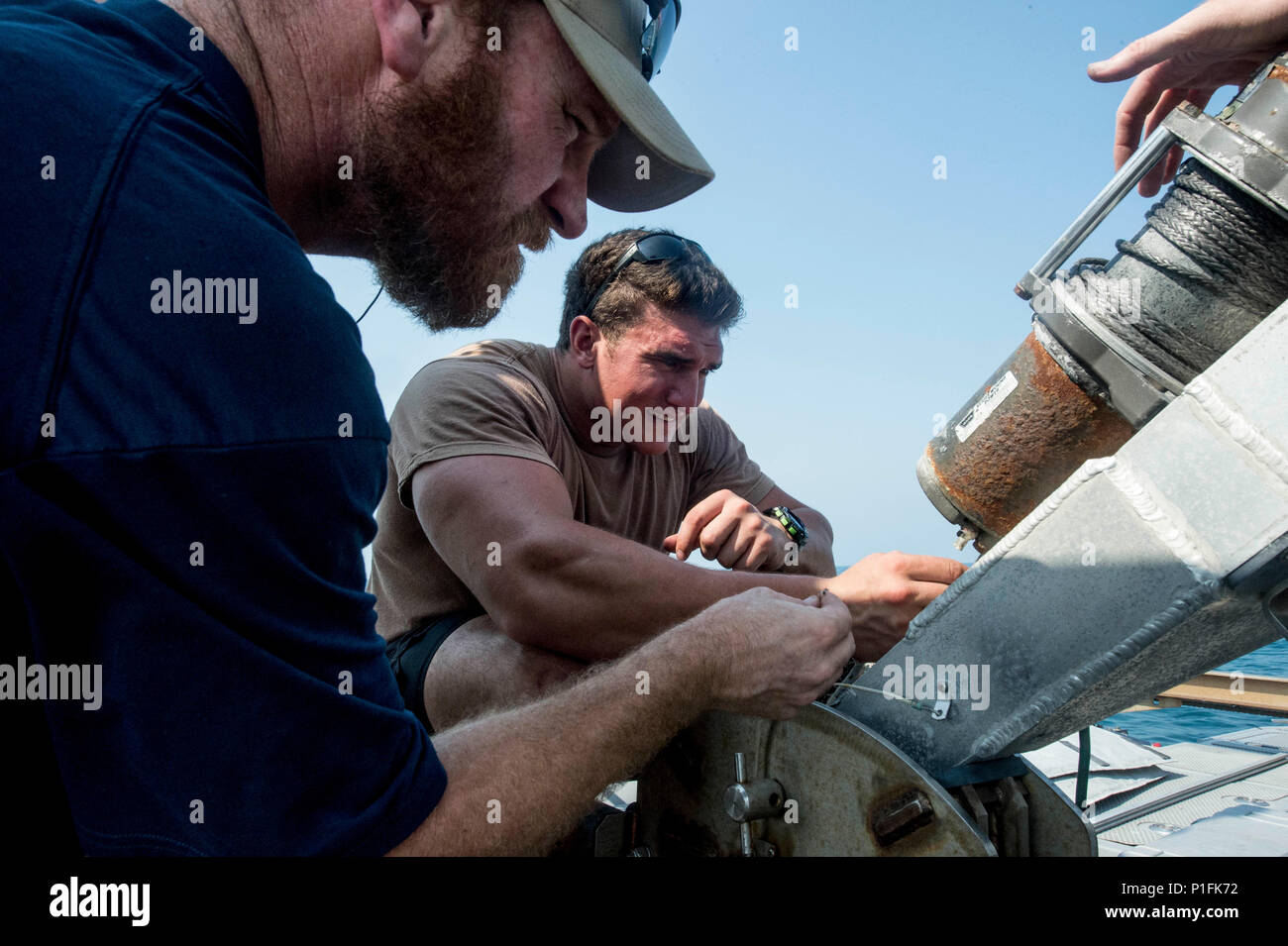 Sailors assigned to Commander, Task Force 56.1 (CTF 56.1), repair a ...