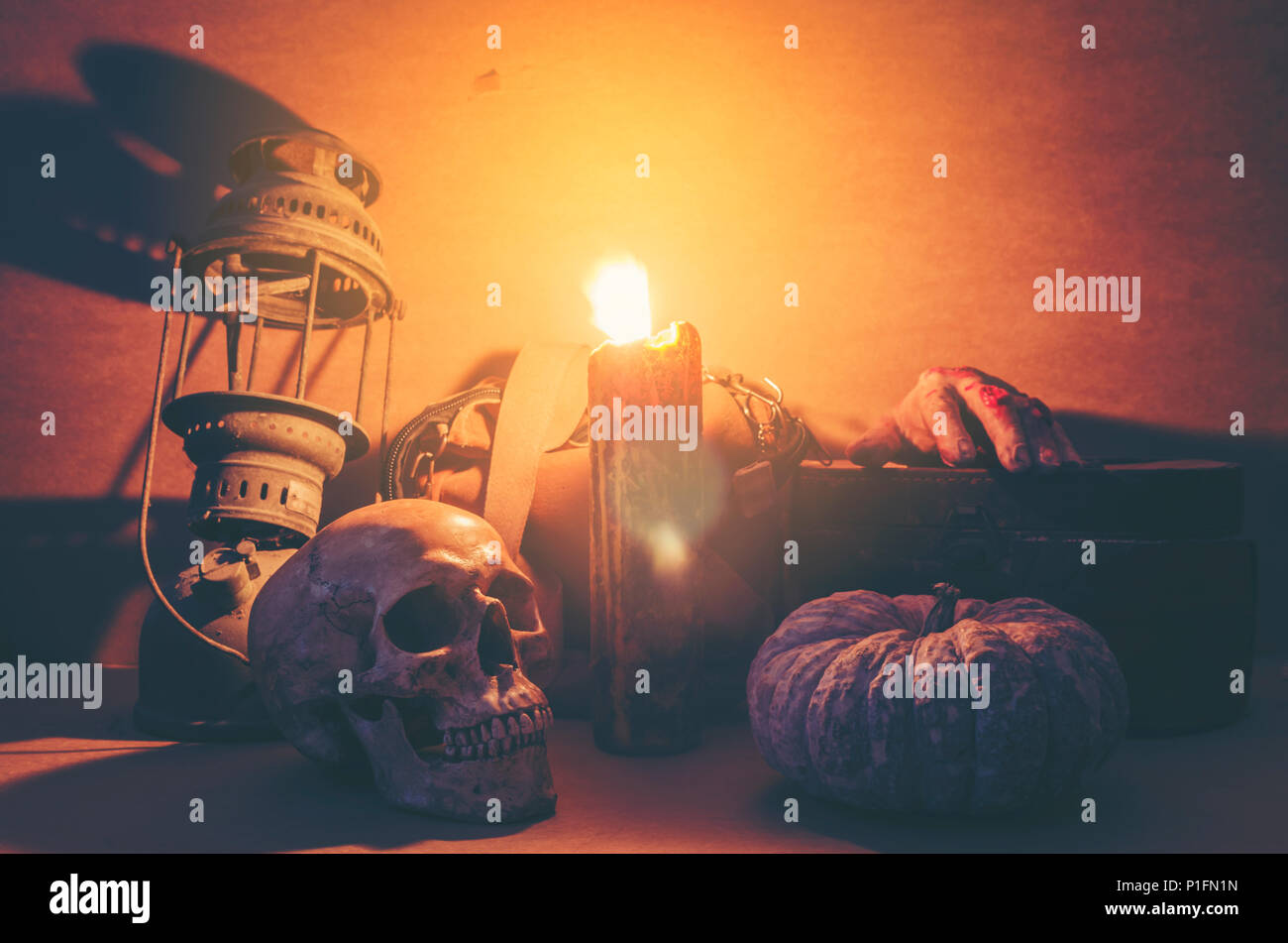Halloween pumpkin head jack lantern and human skull on wooden ...