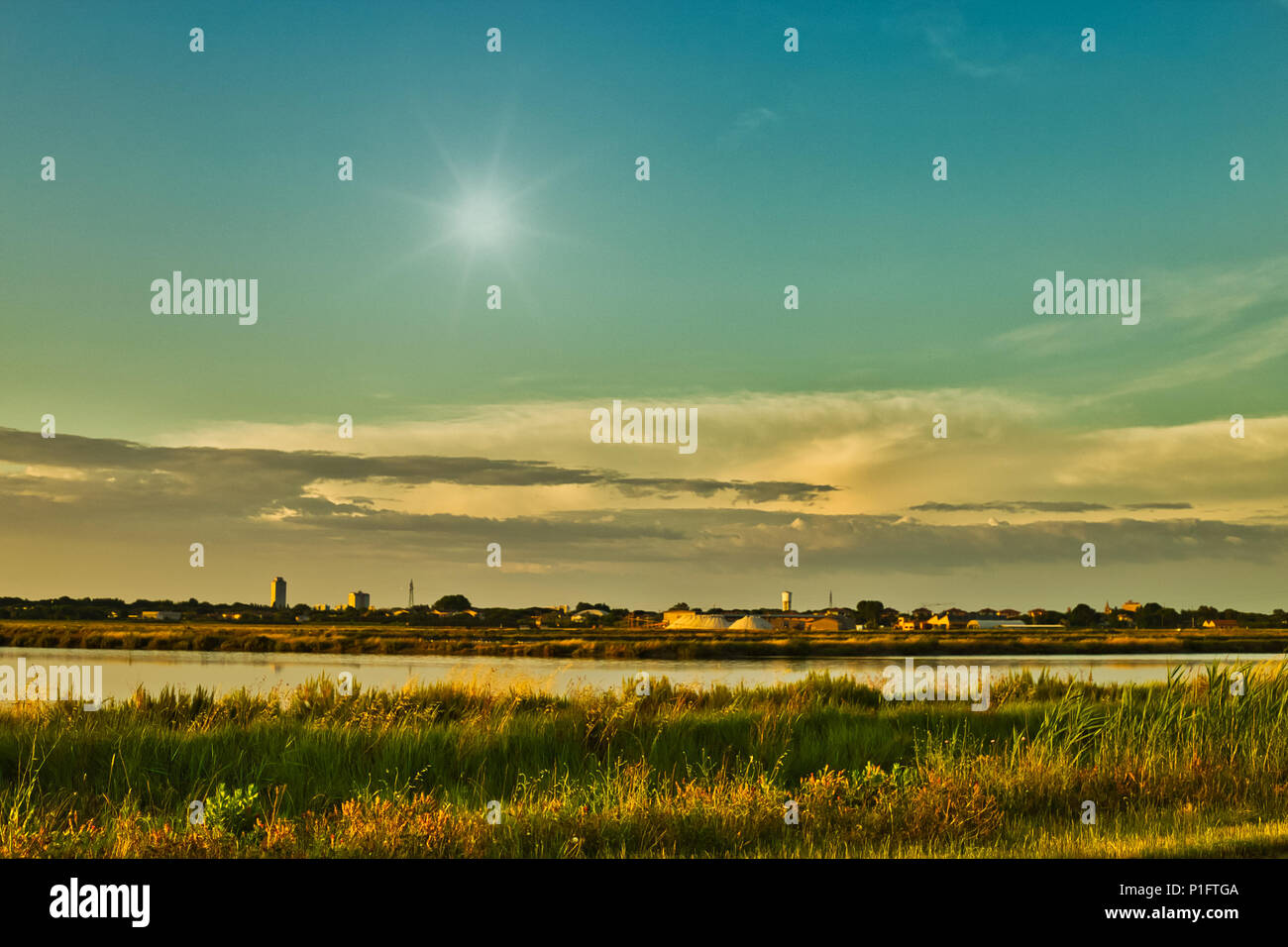 deep sunset on brackish wetlands Stock Photo - Alamy