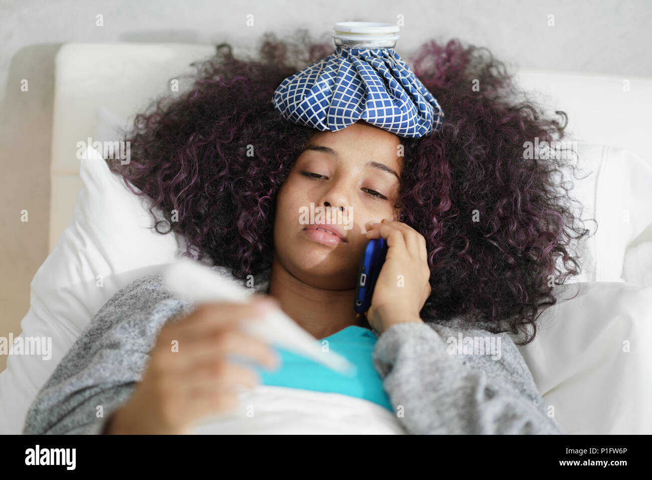 Teenager fever thermometer hi-res stock photography and images - Alamy