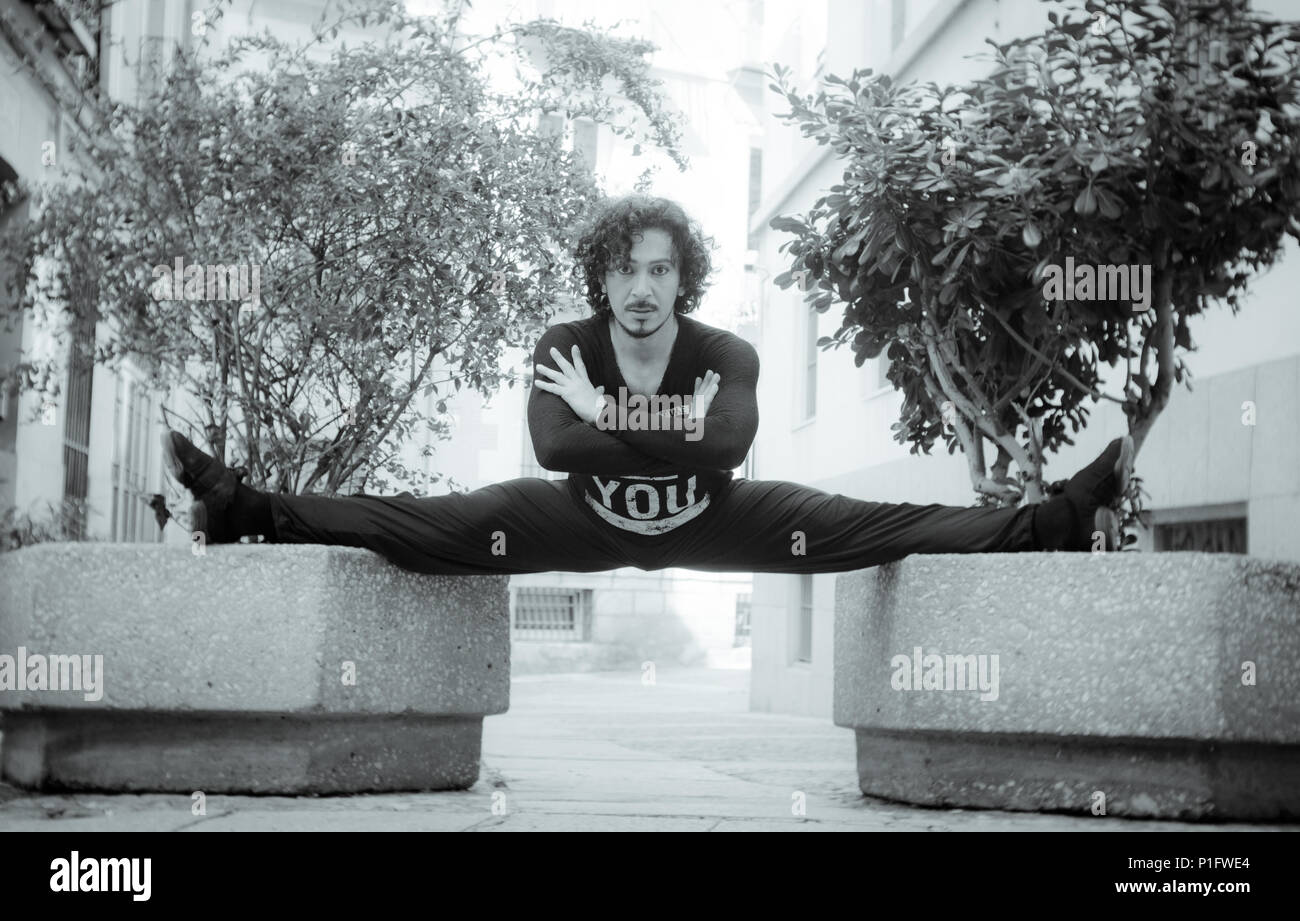 Male dancer in ballet pose. Street background Stock Photo - Alamy